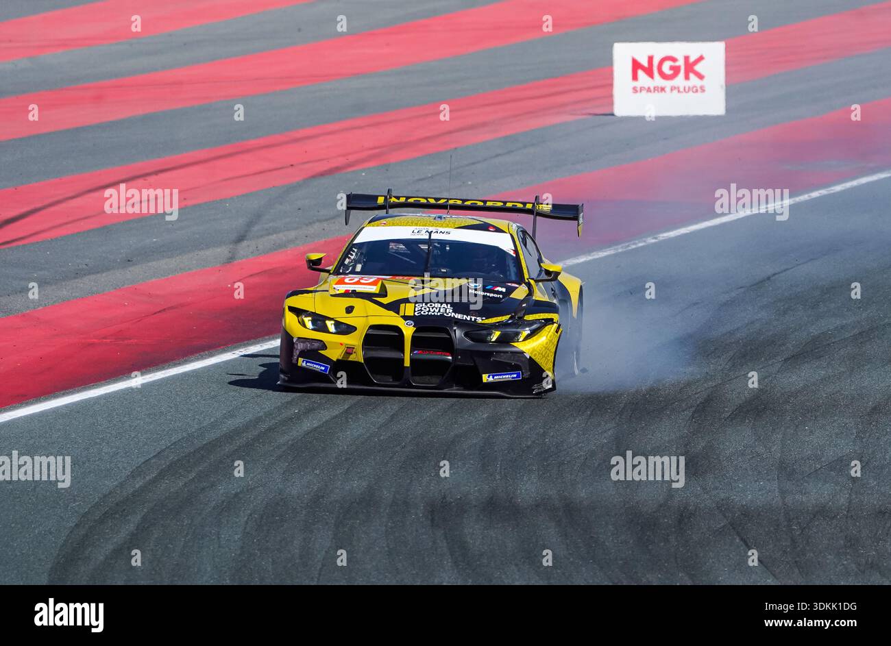 The car of Team WRT, BMW M4 GT3 is seen racing with smoke coming from ...