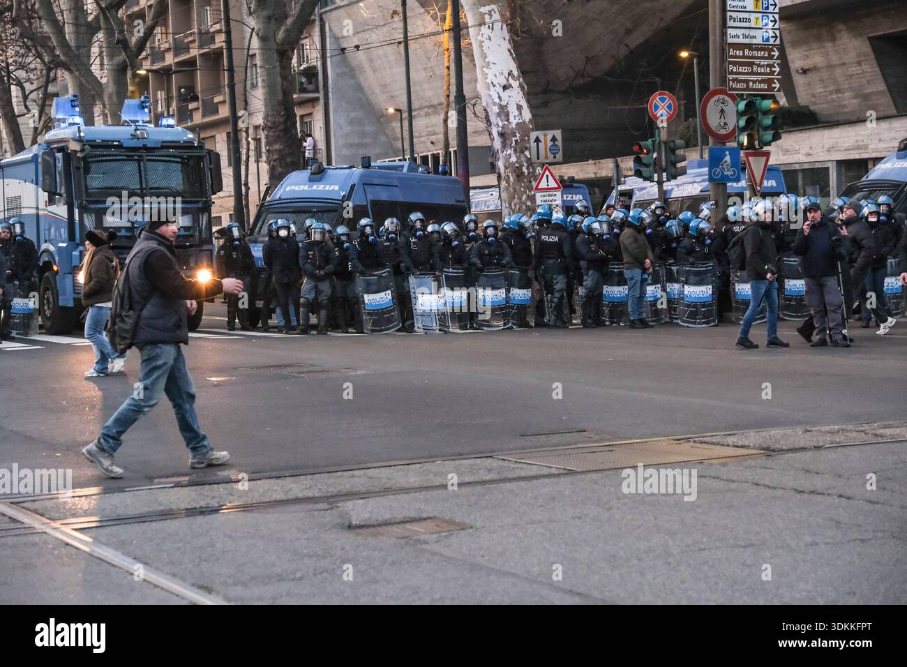 Turin, Italy. 31st Jan, 2026. Riot police deployed a security cordon to ...