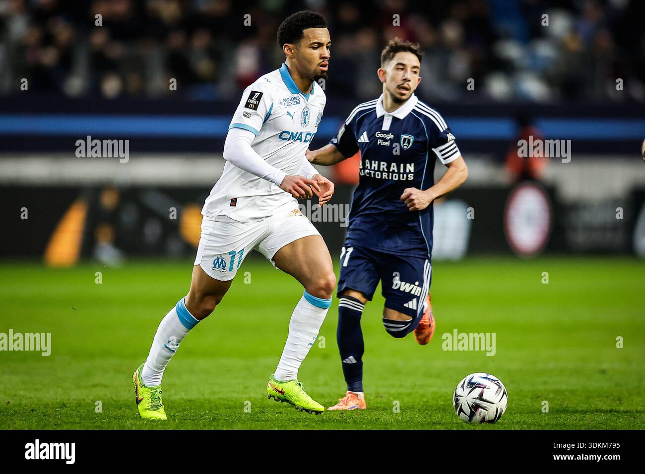 Ethan NWANERI of Marseille and Maxime LOPEZ of Paris FC during the ...