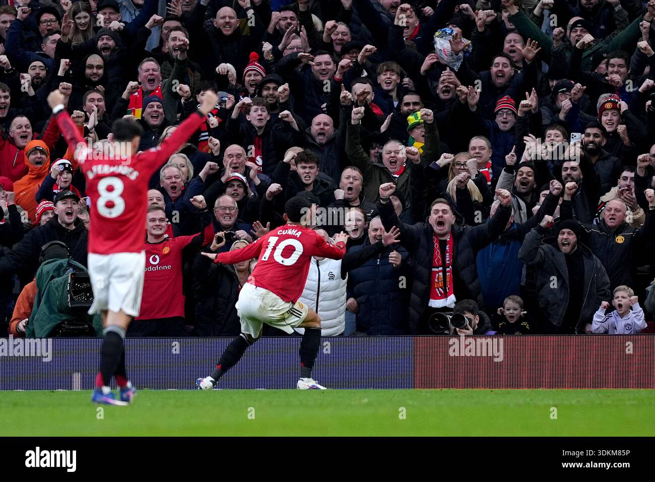 Manchester United's Matheus Cunha (right) celebrates after scoring his ...