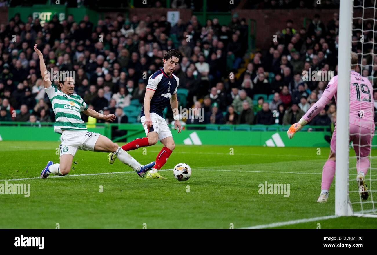 Celtic's Daizen Maeda (left) misses a chance in front of goal during ...