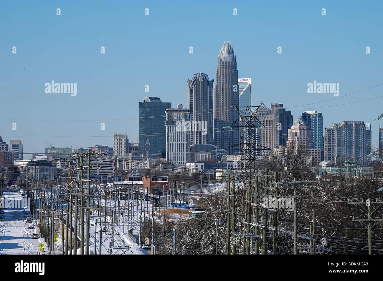Snow covers the streets and rail tracks, Sunday, Feb 1, 2026, in ...