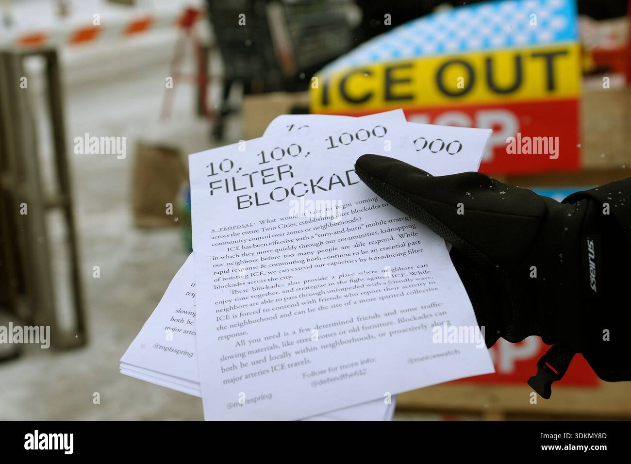 Flyers are handed out to motorists at a blockade set up to deter ...