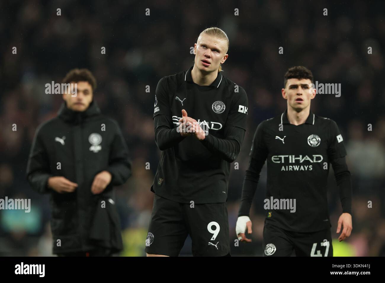 Manchester City's Erling Haaland, center, and Phil Foden leave the ...