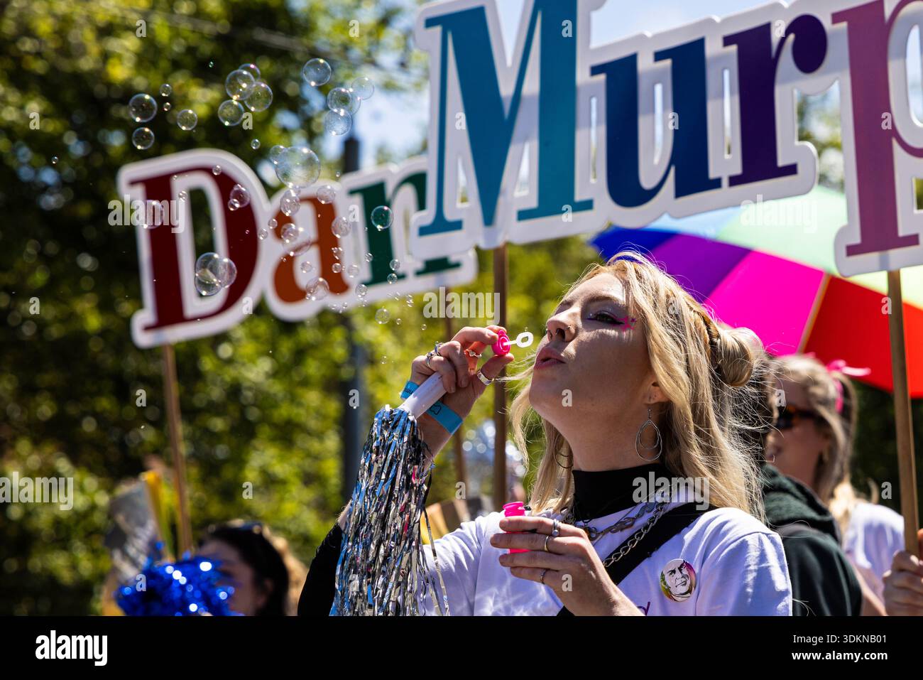 A march attendee is pictured blowing bubbles. Midsumma is a month-long ...