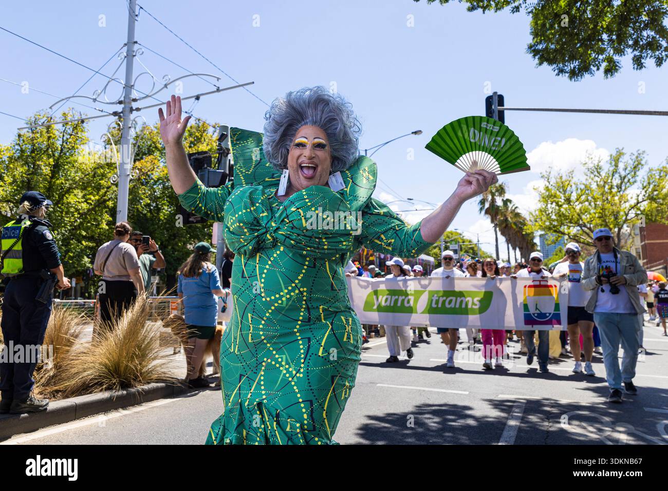 A drag queen marches with the Yarra Trams contingent styled as a tram ...