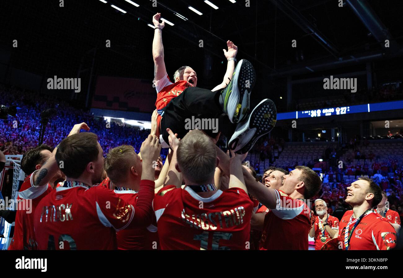 Denmark's head coach Nikolaj Jacobsen is lifted into the air after ...