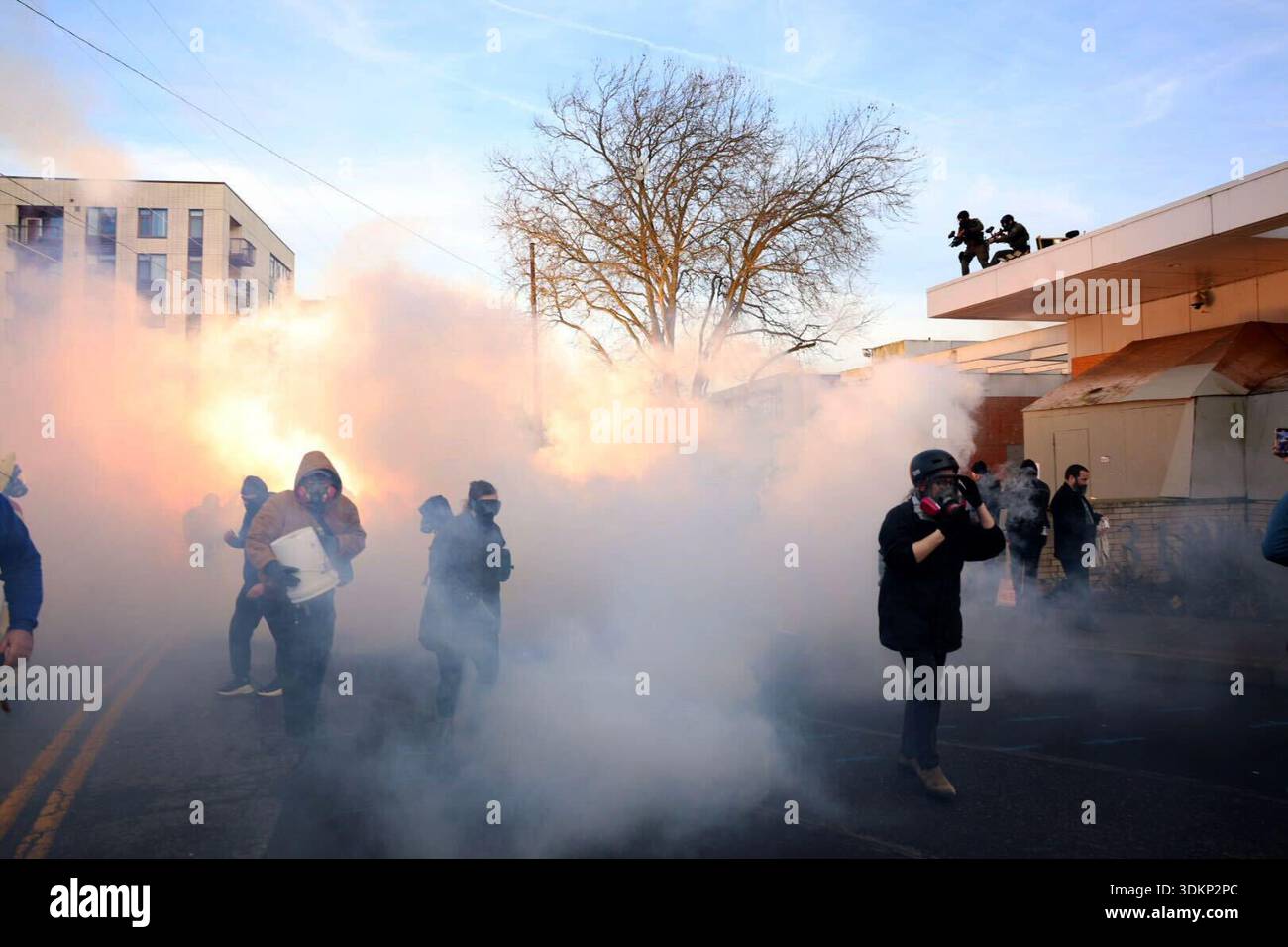 Federal agents lobbed tear gas and flash bangs at protesters in front ...
