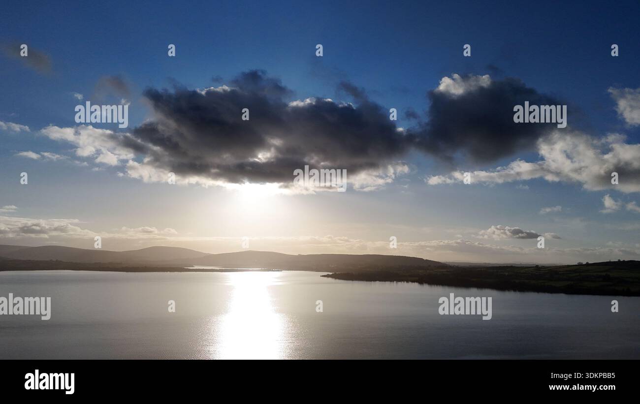 Wicklow, Ireland - 01st February 2026: The sun shines through a dark ...