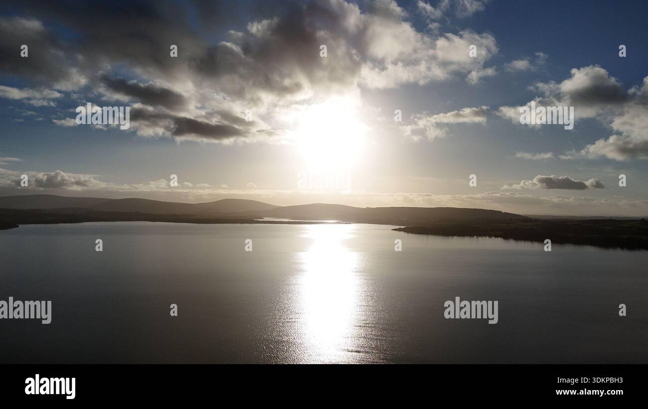 Wicklow, Ireland - 01st February 2026: The sun shines through a dark ...