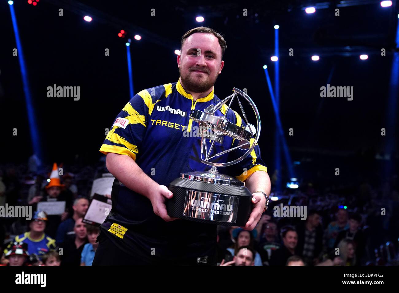 England's Luke Little with the Winmau World Masters trophy during day ...
