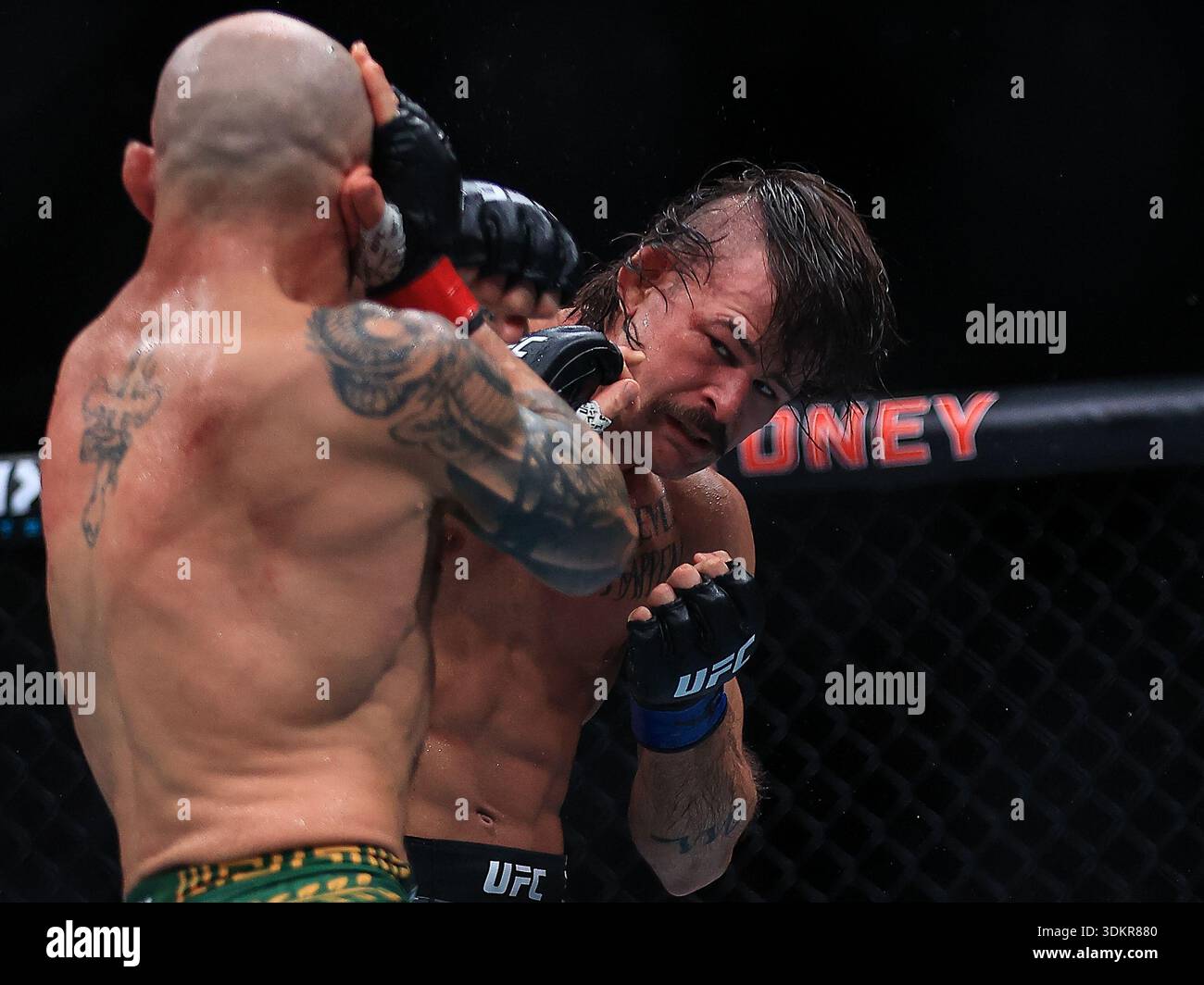 Diego Lopes (R) of Brazil seen in action with Alexander Volkanovski (L ...