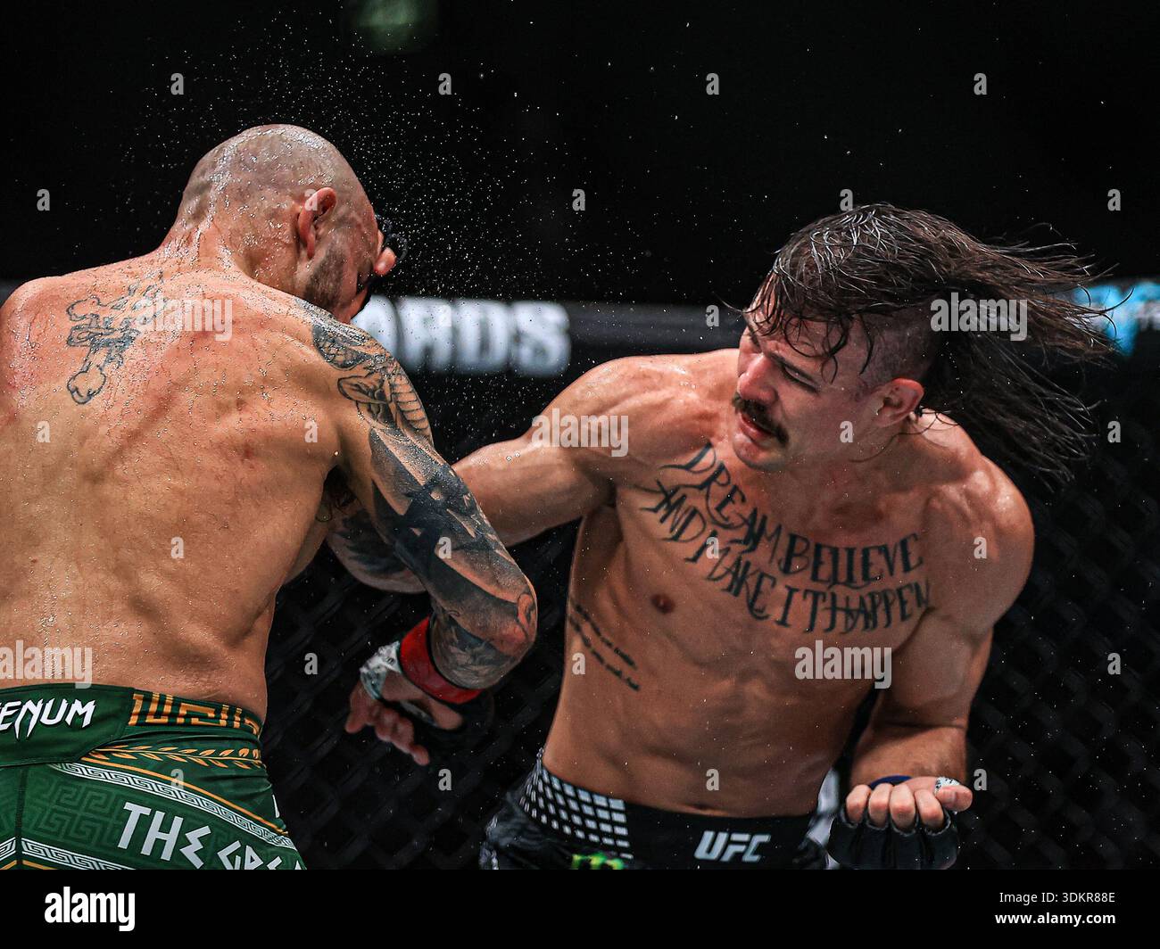 Diego Lopes (R) of Brazil seen in action with Alexander Volkanovski (L ...