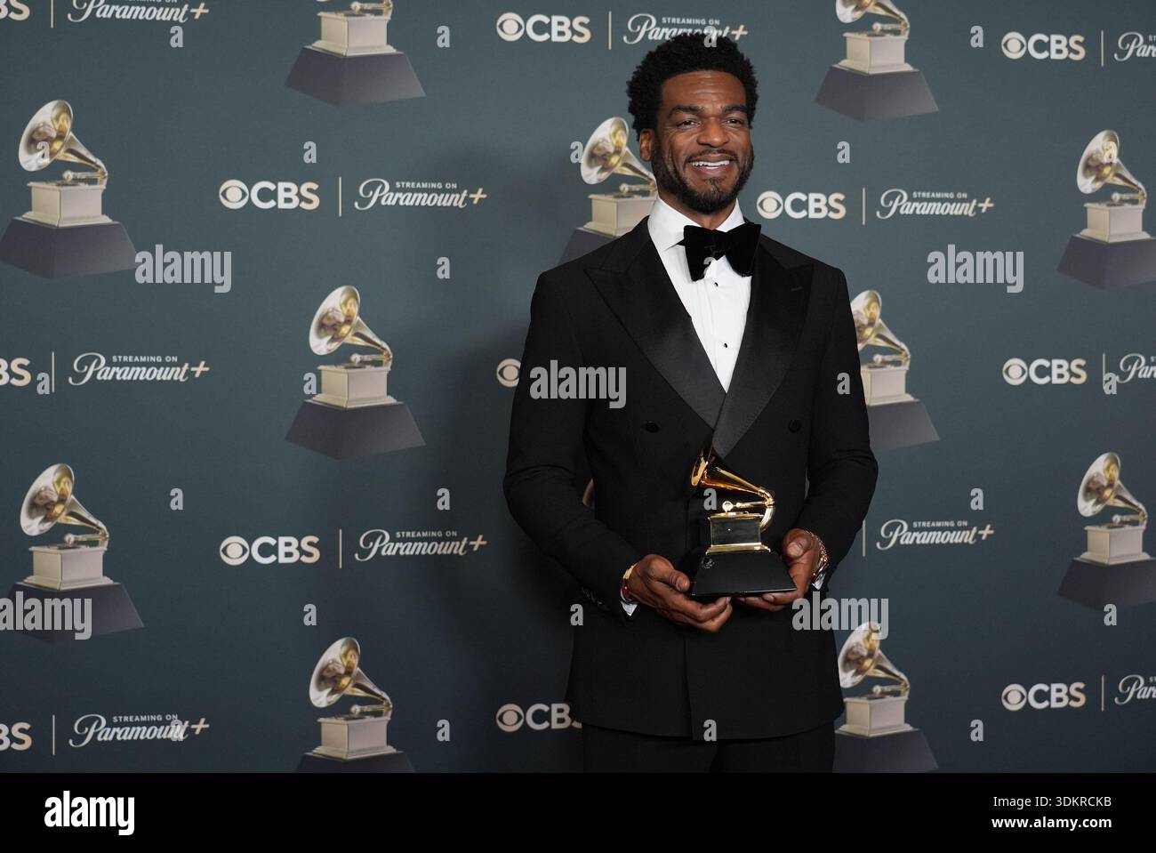 Andre Harris poses in the press room with the award for best R&B song ...