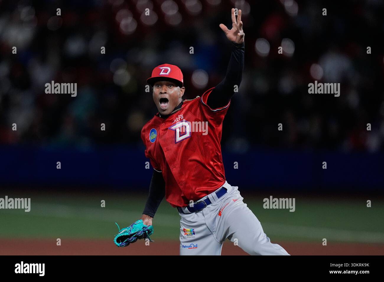 Dominican Republic's pitcher Jefry Yan reacts to a strikeout against ...