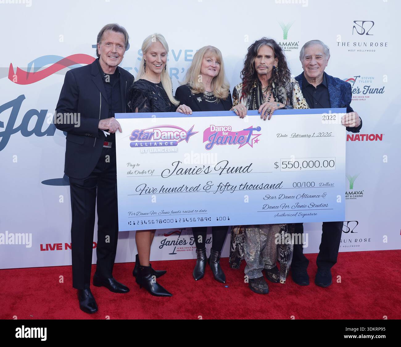 Steven Tyler and Guests pose with the donation check at the 7th Annual ...
