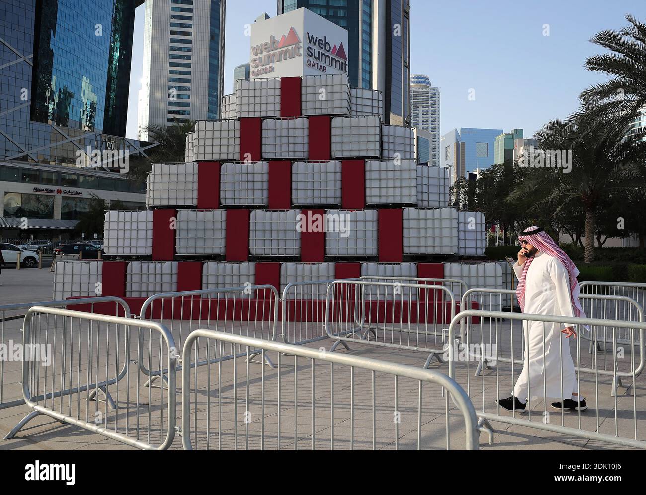 A man walks past a model of Web Summit 2026, the world's largest ...
