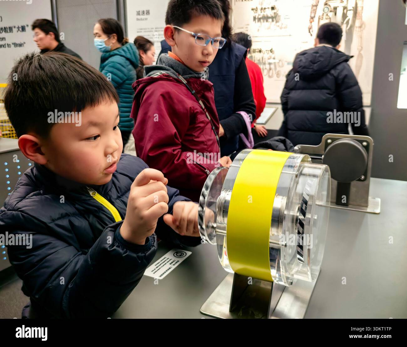 Visitors interact with exhibits at the renovated Shanghai Science and ...