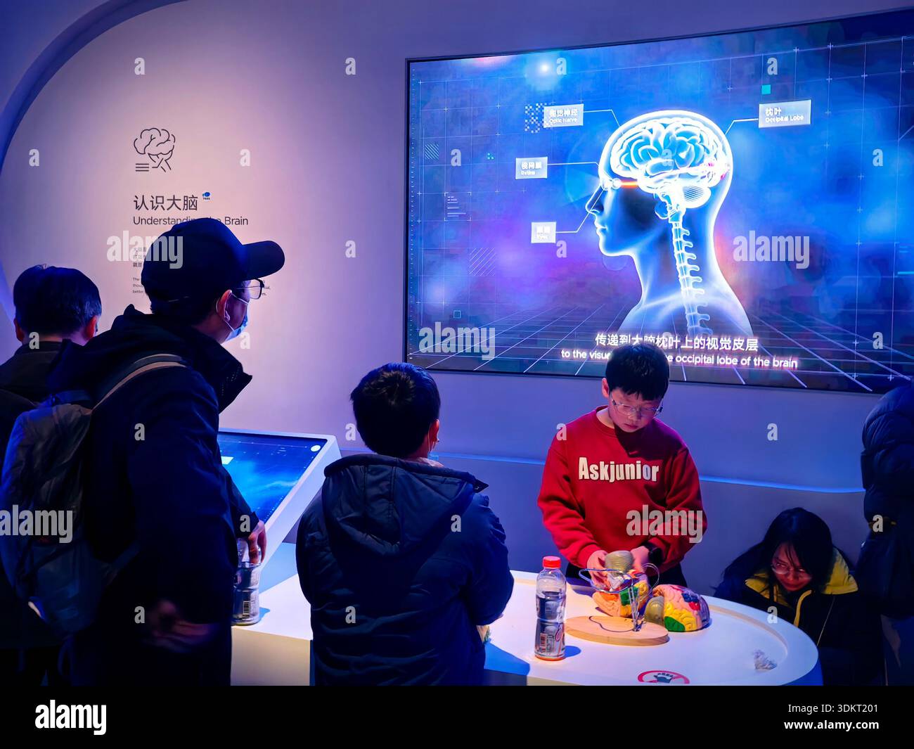 Visitors interact with exhibits at the renovated Shanghai Science and ...