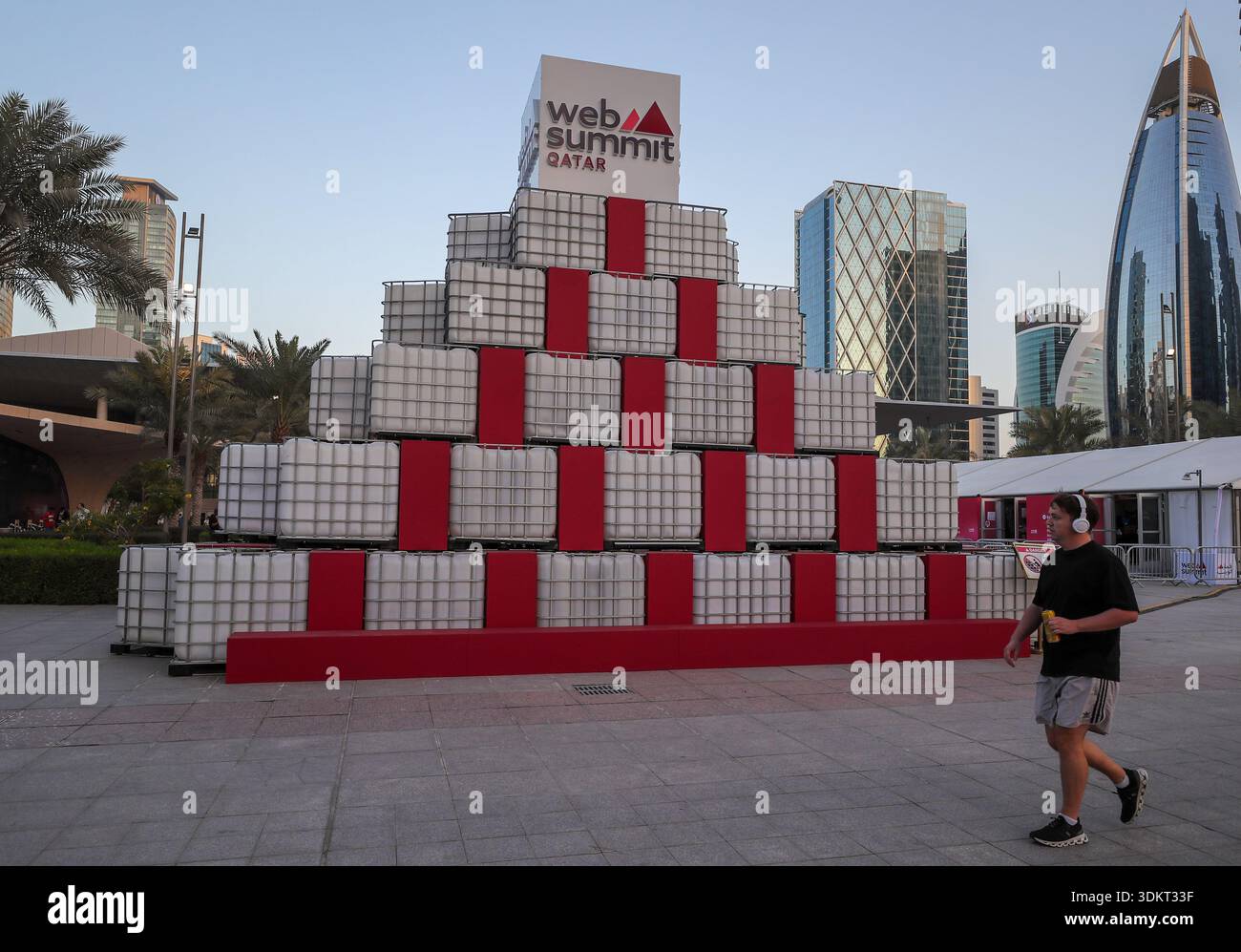 A man walks past a model of Web Summit 2026, the world's largest ...