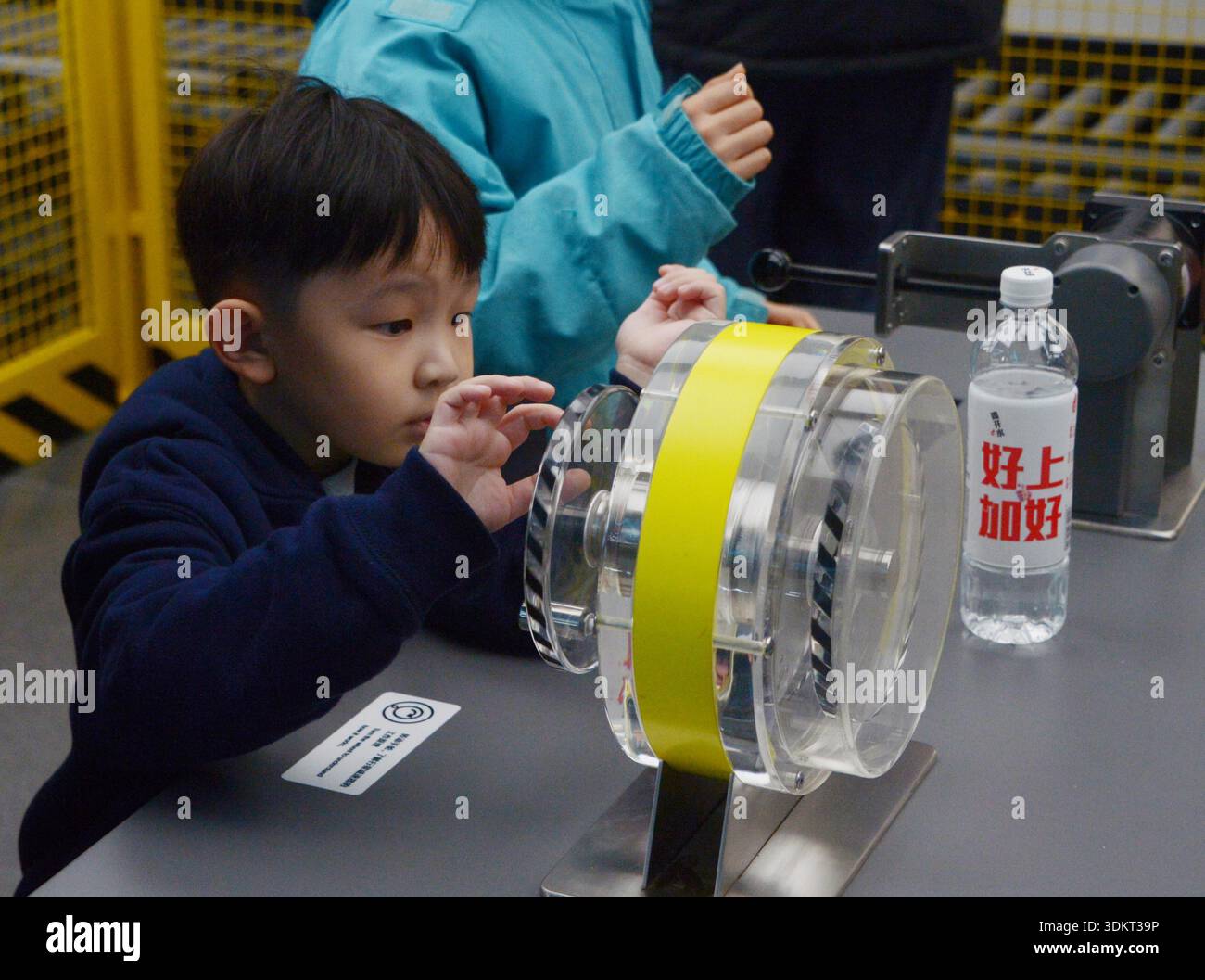 Visitors interact with exhibits at the renovated Shanghai Science and ...