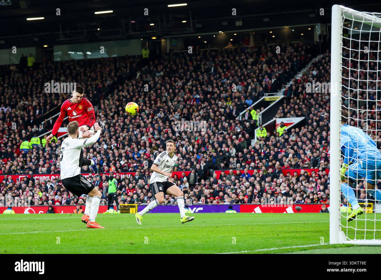 Manchester United forward Benjamin Sesko (30) heads the ball at goal ...