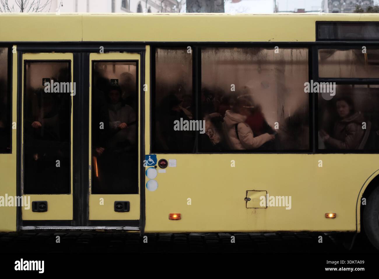 A crowded bus drives through central Lviv, western Ukraine, on a cold ...