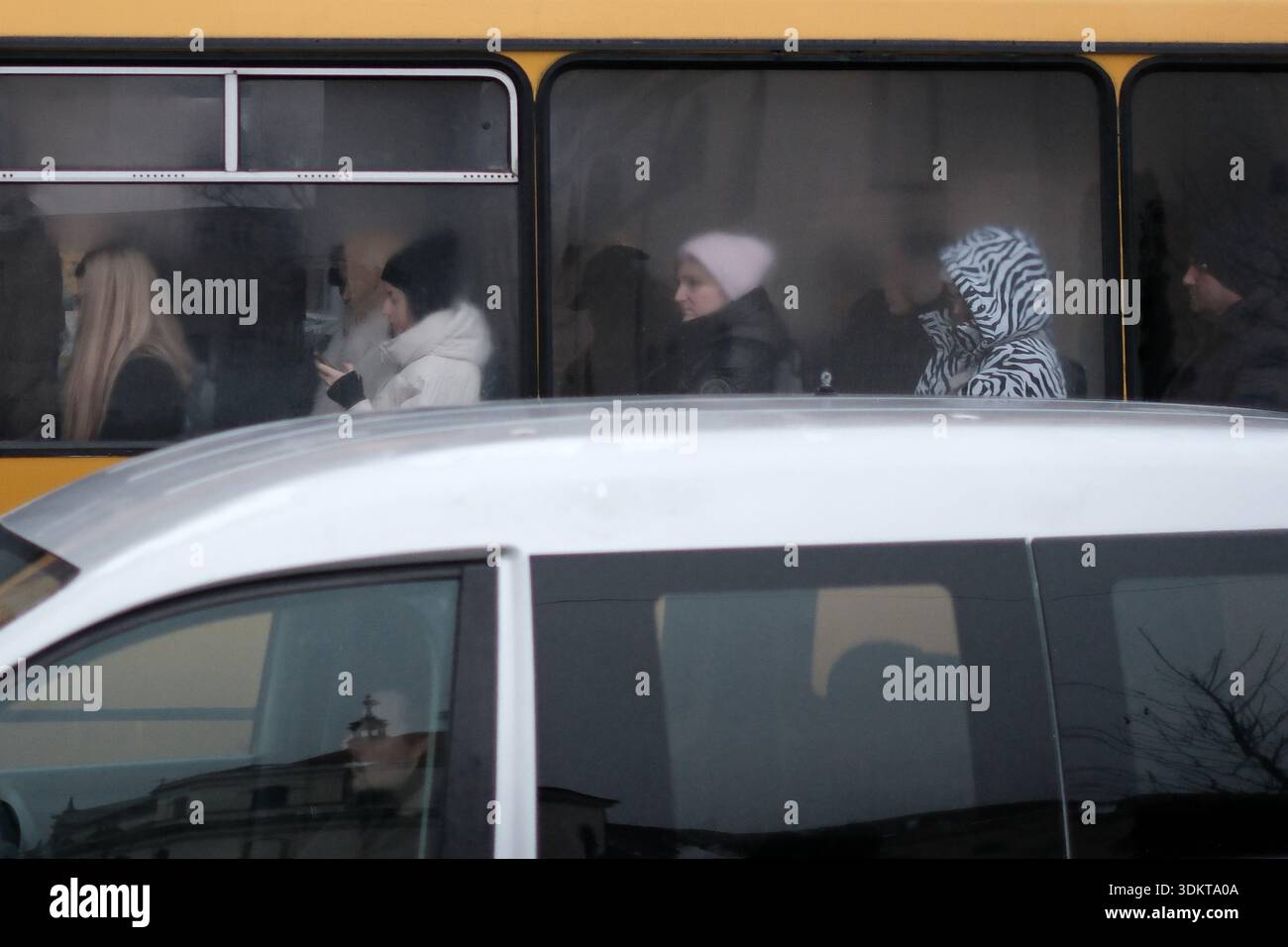 A crowded bus drives through central Lviv, western Ukraine, on a cold ...