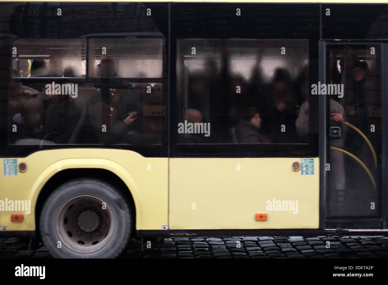 A crowded bus drives through central Lviv, western Ukraine, on a cold ...