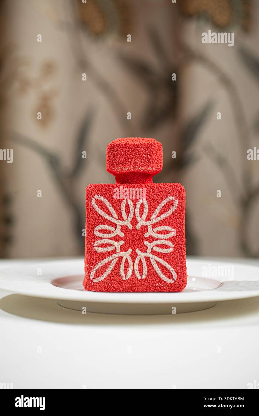 Red velvet mousse dessert shaped like perfume bottle Stock Photo - Alamy