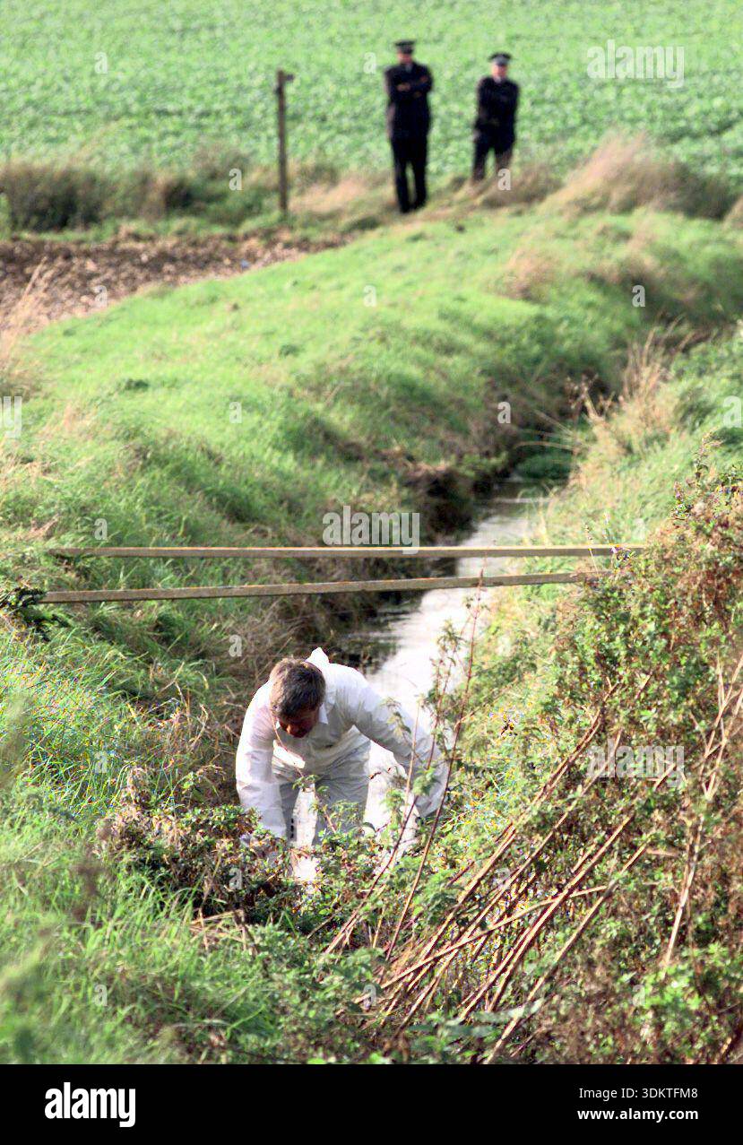 File photo dated 25/09/99 of scene of crime investigators at the site ...