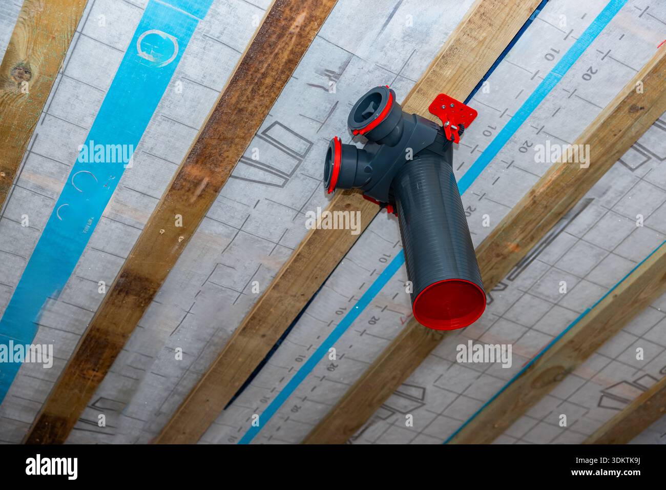 Ceiling mounted heat recovery ventilation system with black duct, red ...