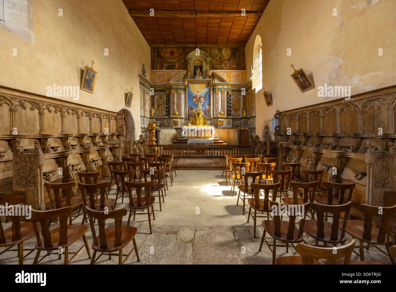 Interior of a historic Catholic church showing the altar, wooden choir ...