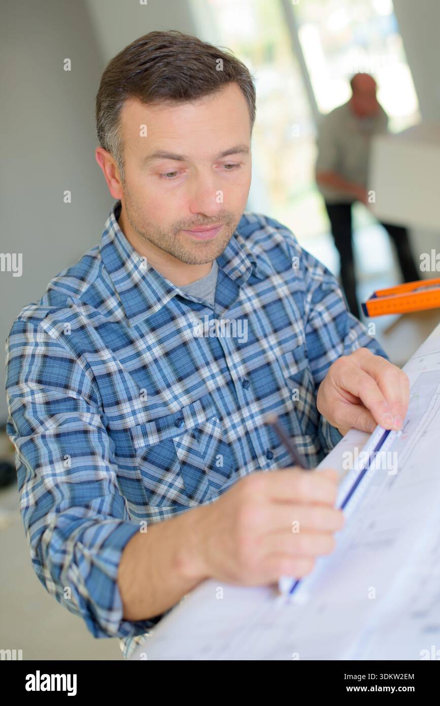 Professional male architect using ruler hi-res stock photography and ...