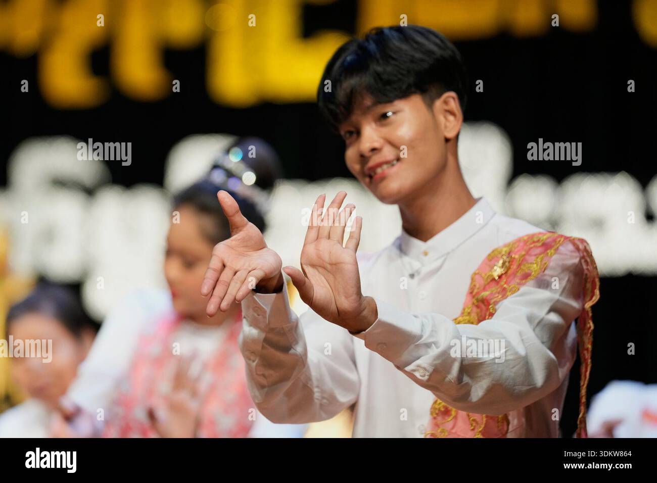 Members of the Mon tribe's artist troupe perform a traditional dance ...