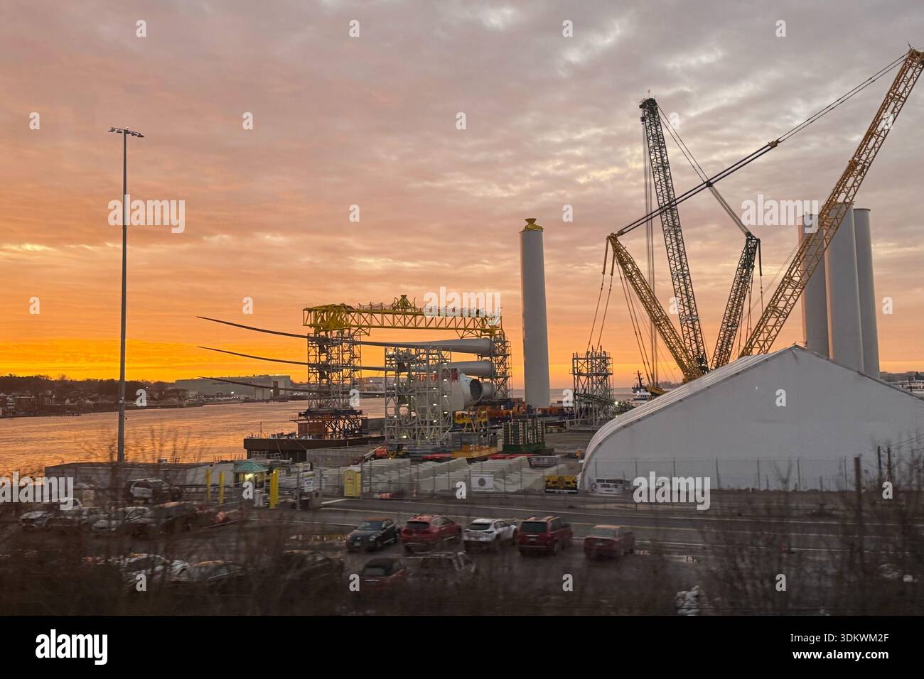 FILE - Blades and turbine bases for offshore wind sit at a staging area ...