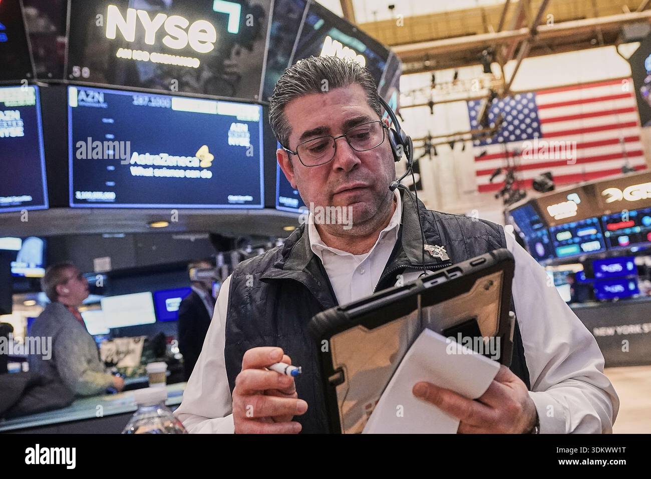 Trader Michael Capolino works on the floor of the New York Stock ...