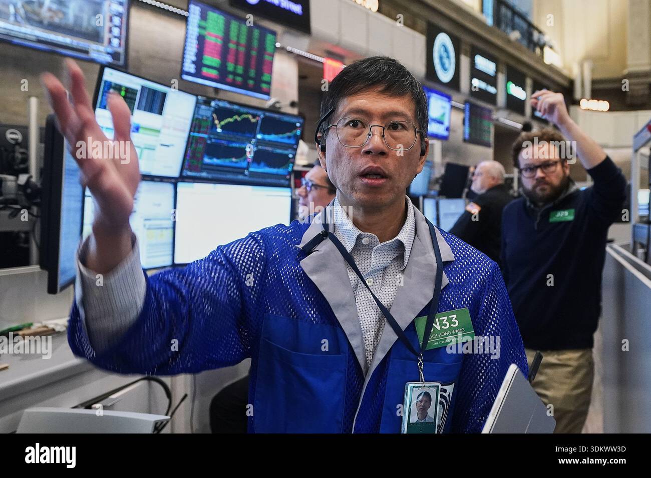 Options trader Chih-Hong Wang works on the floor of the New York Stock ...