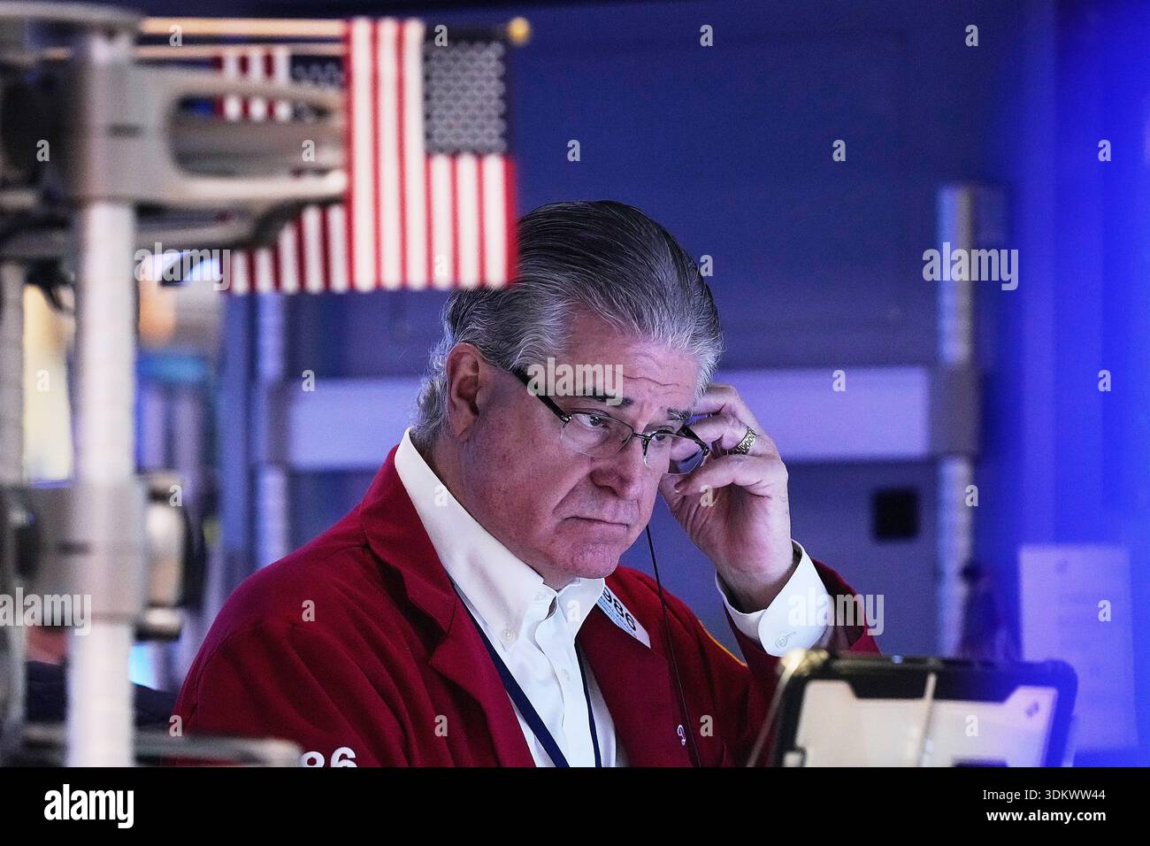 Trader Daniel Kryger works on the floor of the New York Stock Exchange ...