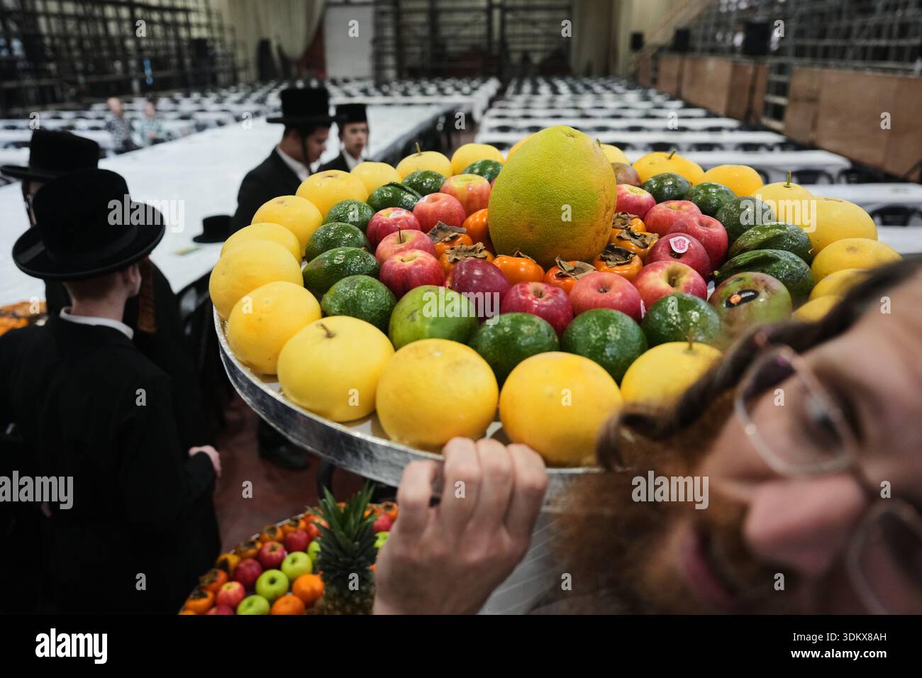 Ultra-Orthodox Jews from the Sanz Hasidic dynasty prepare a table with ...