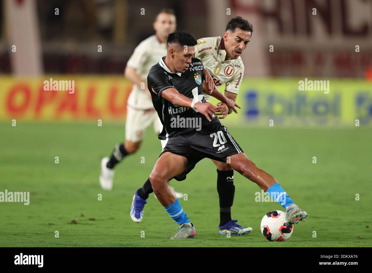 Arthur Gutierrez of Asociacion Deportiva Tarma and Lisandro Alzugaray ...