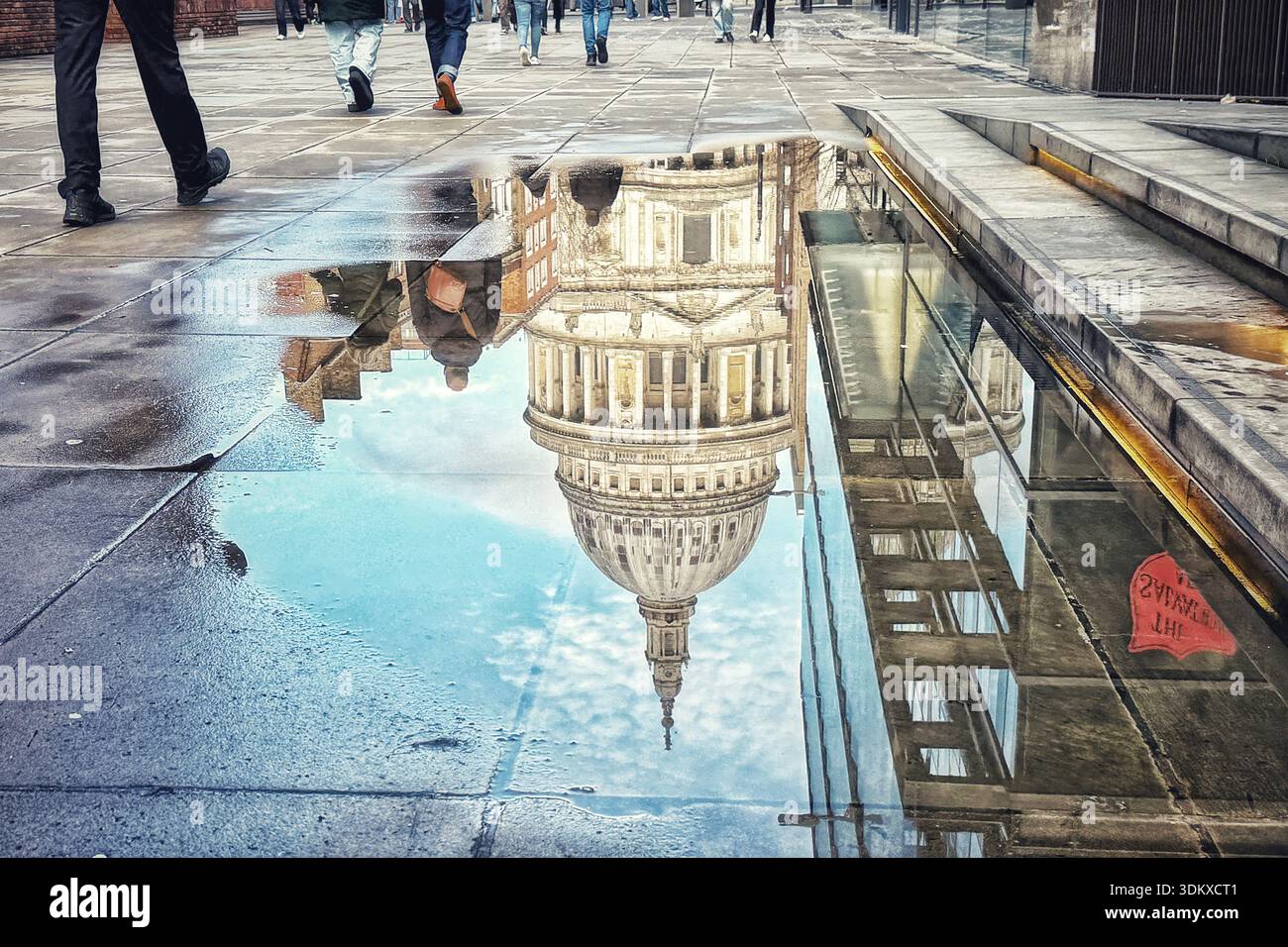 Reflection of iconic St Paul’s cathedral roof dome in a puddle at the ...