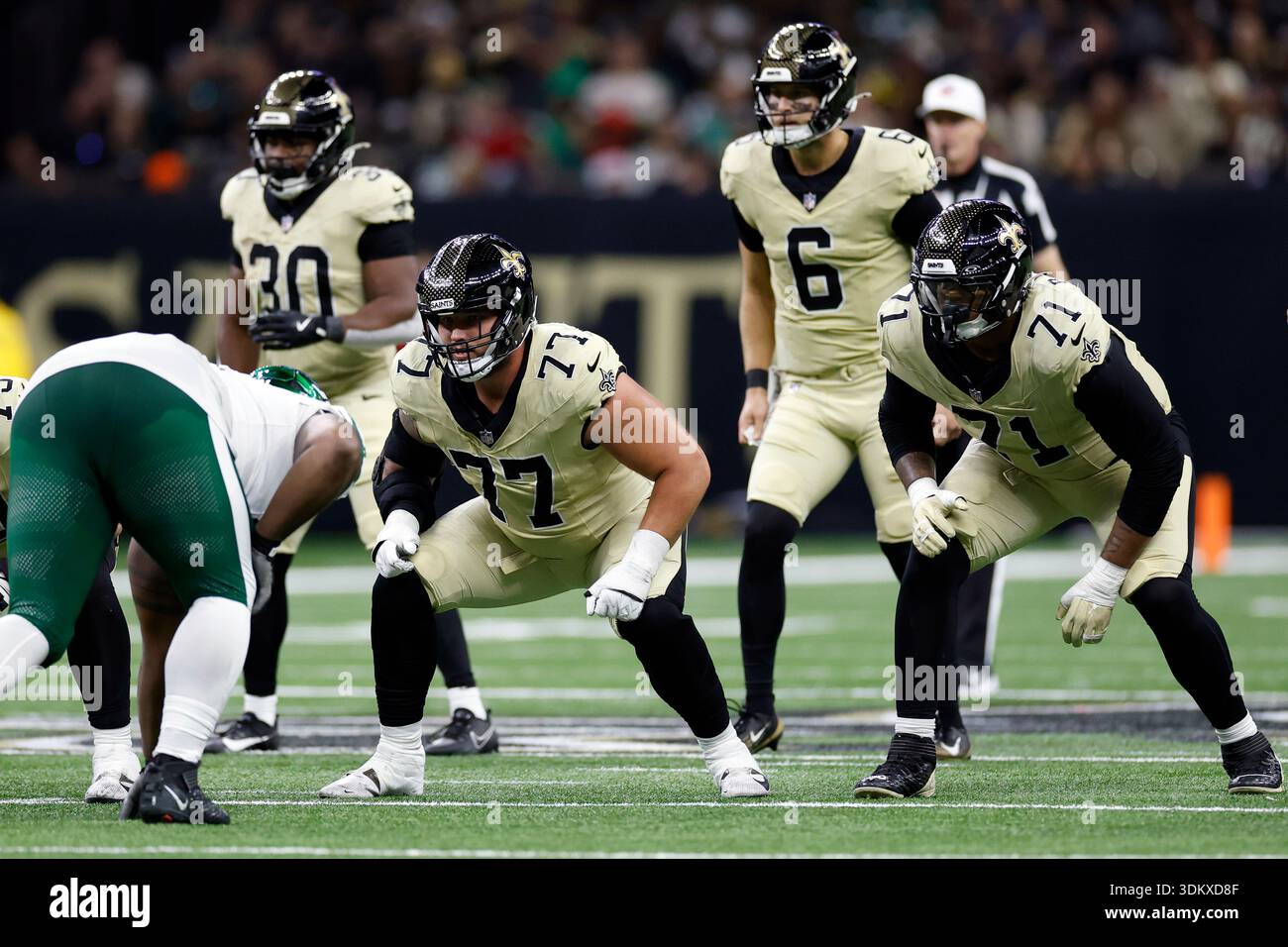 New Orleans Saints guard Dillon Radunz (77) lines up during an NFL ...
