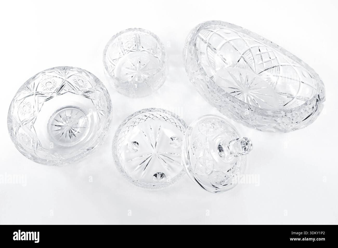 Transparent crystal ware of the various design and shapes on light ...