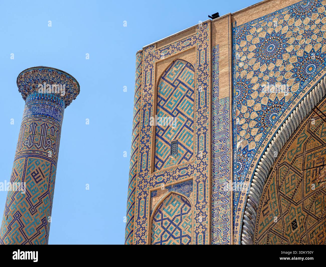 Facade and minaret on Ulugh Beg Madrasah in Samarkand's Registan square ...