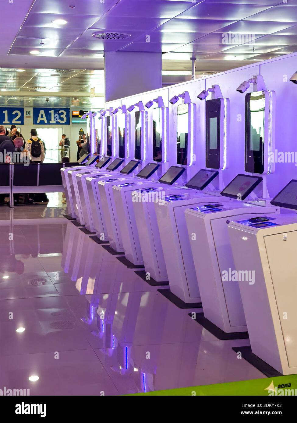 Automated EES check-in kiosks in a modern airport terminal, featuring ...