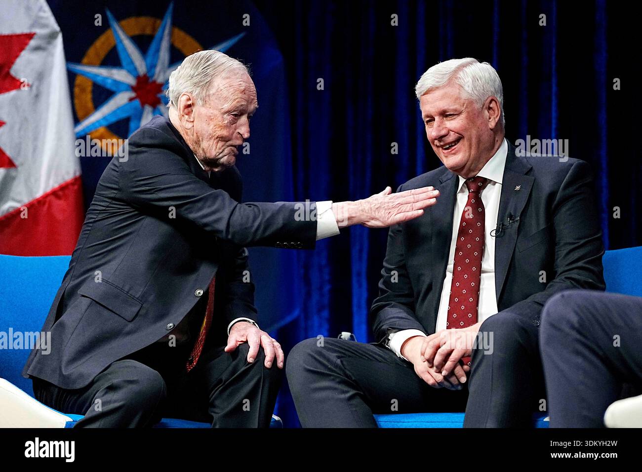 Former prime minister Jean Chretien, left, jokes about the Shawinigan ...