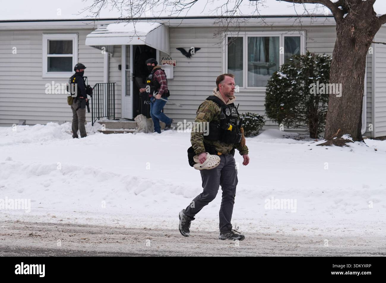 ATF officers conduct an immigration enforcement operation in a ...