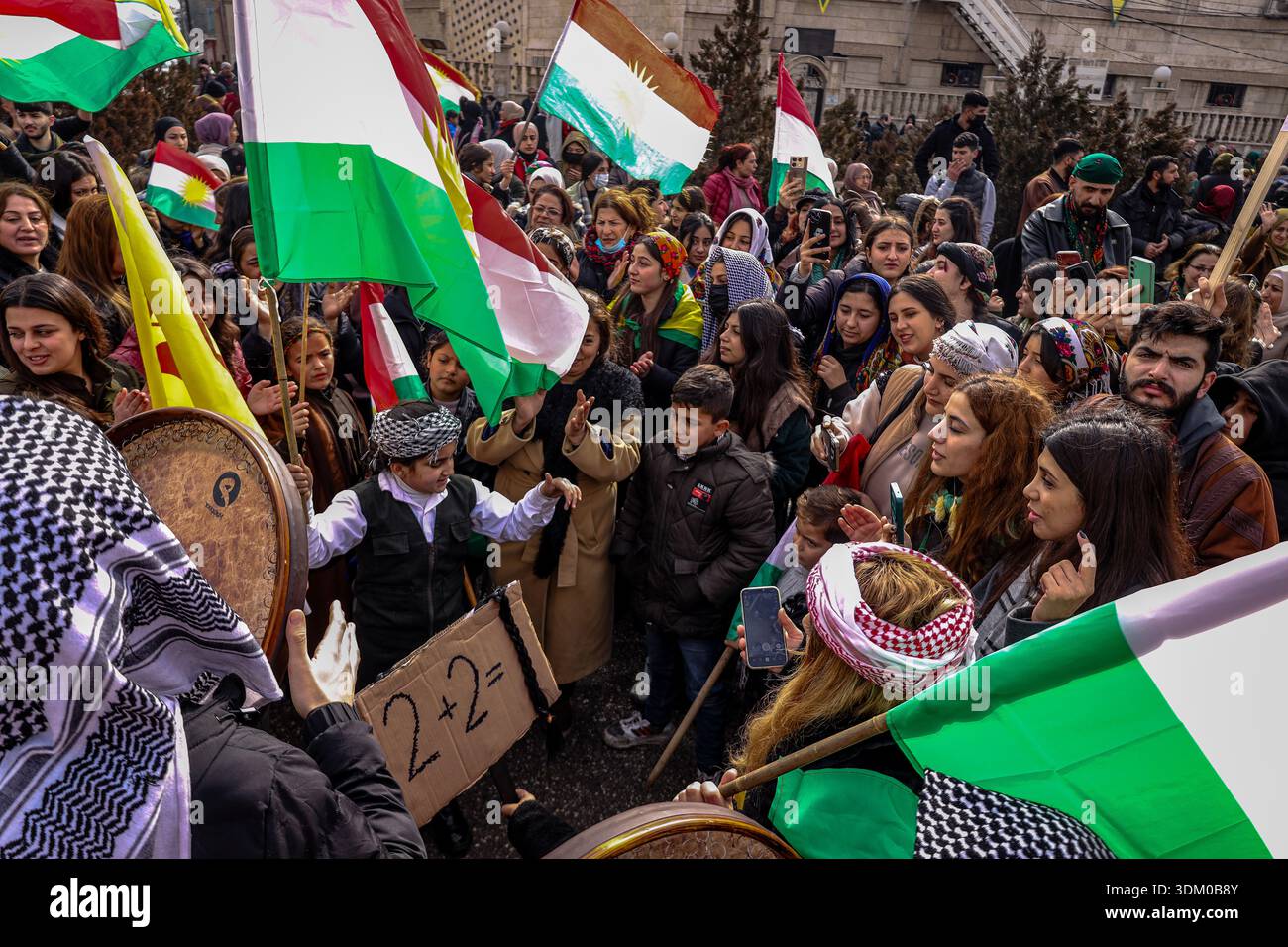 Kurdish demonstraters wave Kurdistan flags during a demonstration in ...
