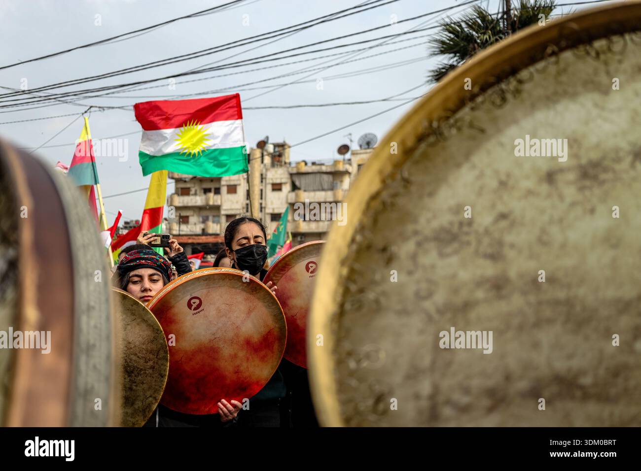 Kurdish demonstraters strike traditional "daf" hand drums during a ...